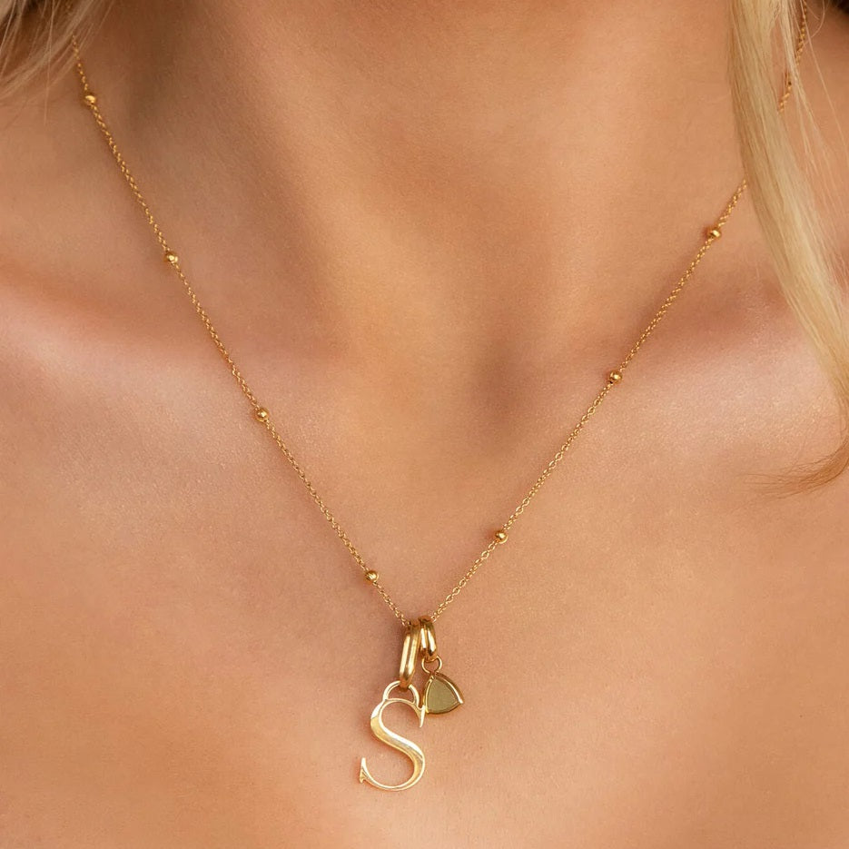 What is the difference between a charm and a pendant? – Abbott Lyon US